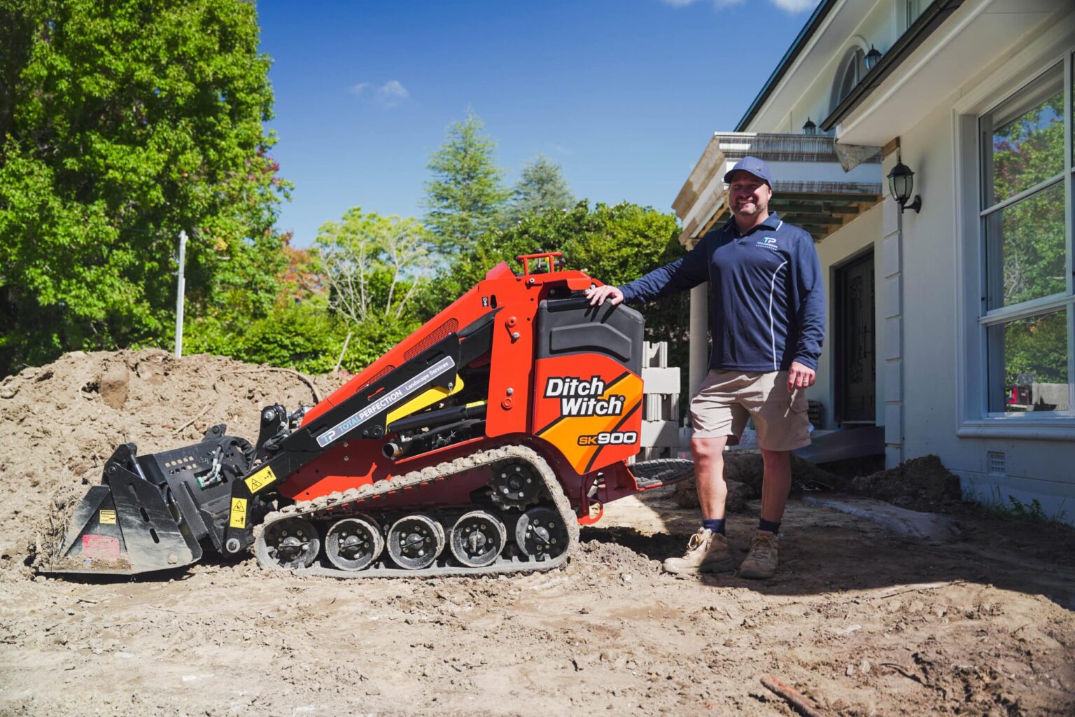 Ditch Witch SK900 mini skid steer - Landscape Contractor